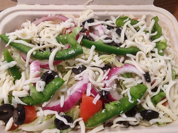 A salad at a pizza place is like bringing an umbrella to the beach—seems unnecessary until you realize it's exactly what you needed.