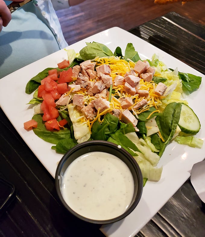 A salad that actually makes you forget you're eating healthy—fresh greens, protein, and a dressing worth bottling and taking home.