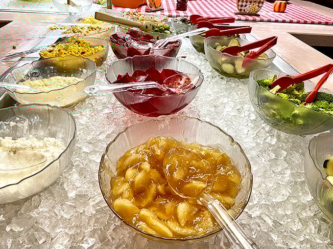 The salad bar—where good intentions meet delicious reality. Those puddings aren't judging your vegetable-to-dessert ratio.