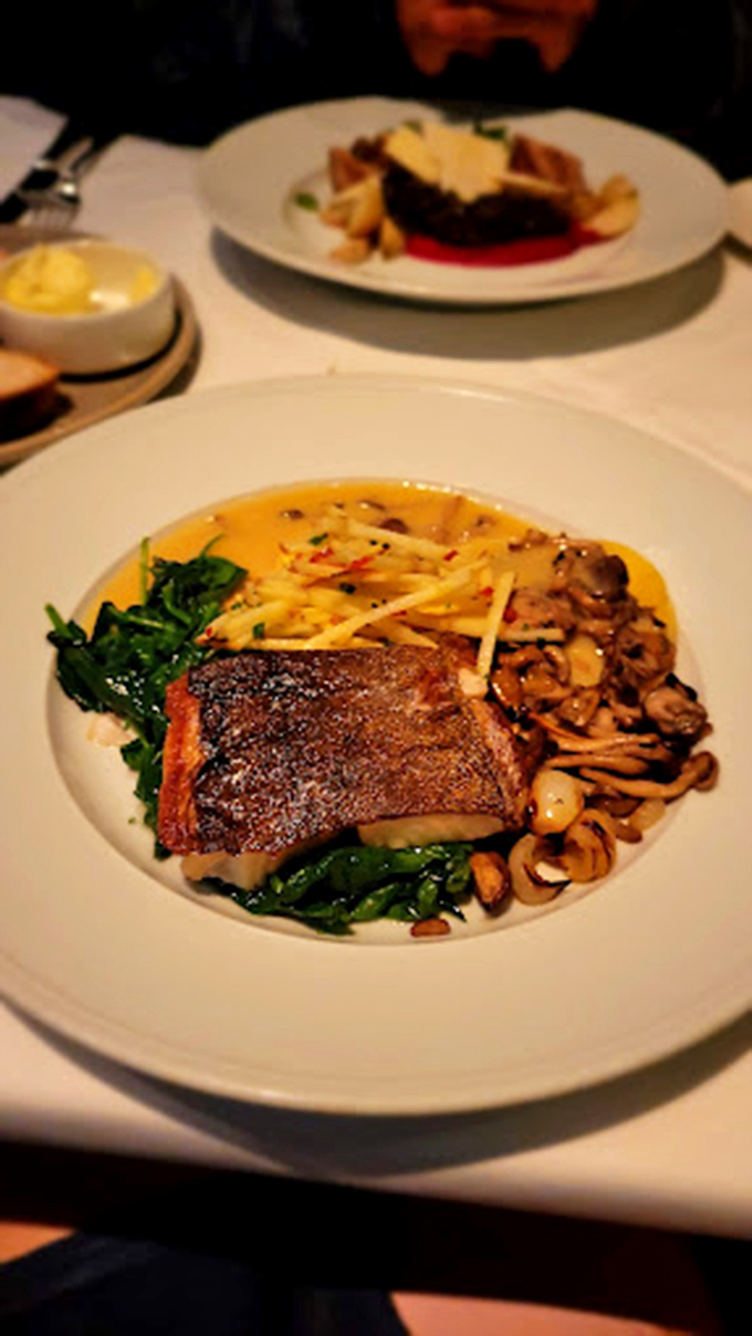 Sea bass with skin so perfectly crisped it deserves its own fan club. Those mushrooms aren't sidekicks—they're co-stars in this delicious drama.