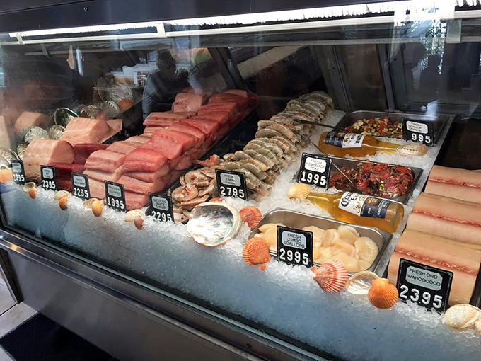 The seafood case—where tomorrow's dinner meets today's lunch. Like a jewelry store, but with treasures you can actually eat.