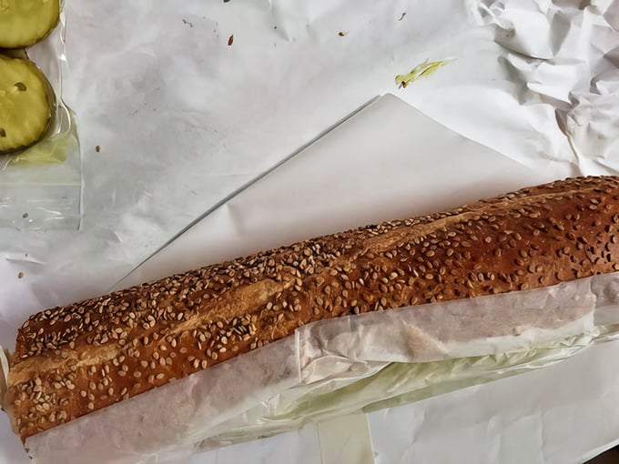 Seeded rolls waiting patiently to fulfill their destiny as vessels for sandwich greatness – the unsung heroes of hoagie excellence.