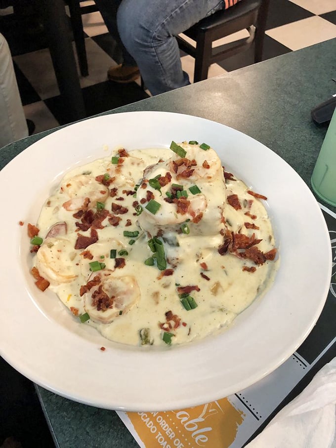 Shrimp swimming in creamy grits with bacon confetti. If the ocean and farmland had a delicious baby, this would be it.