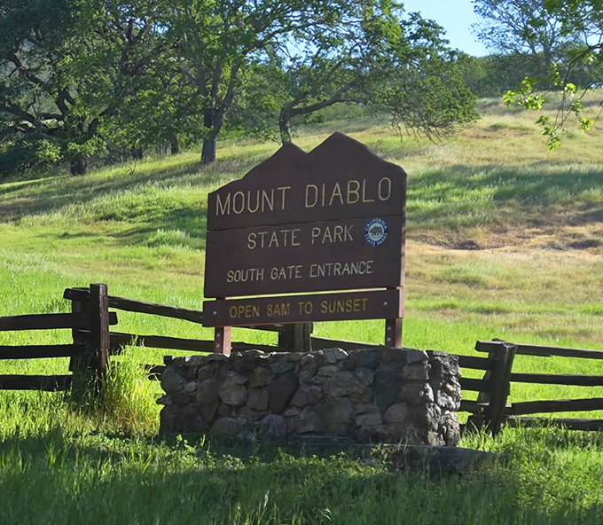 The South Gate entrance sign—your official invitation to leave behind traffic jams and enter a world where cell reception is spotty but views are perfect.