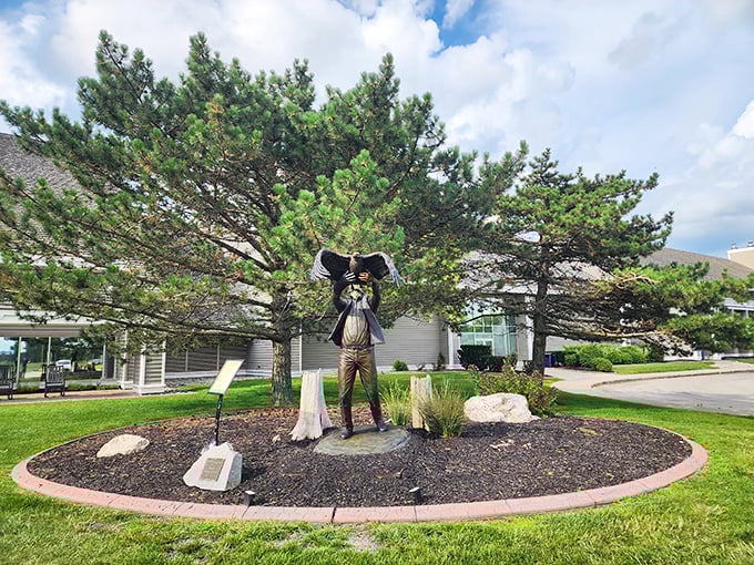 Art meets nature at the park's entrance. This bronze guardian has witnessed countless family memories in the making—and probably some impressive sunburns.