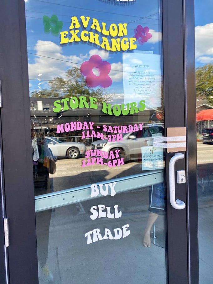 The colorful door sign reveals the magic hours when fashion treasure hunting is permitted. Note the pet-friendly policy—style knows no species!