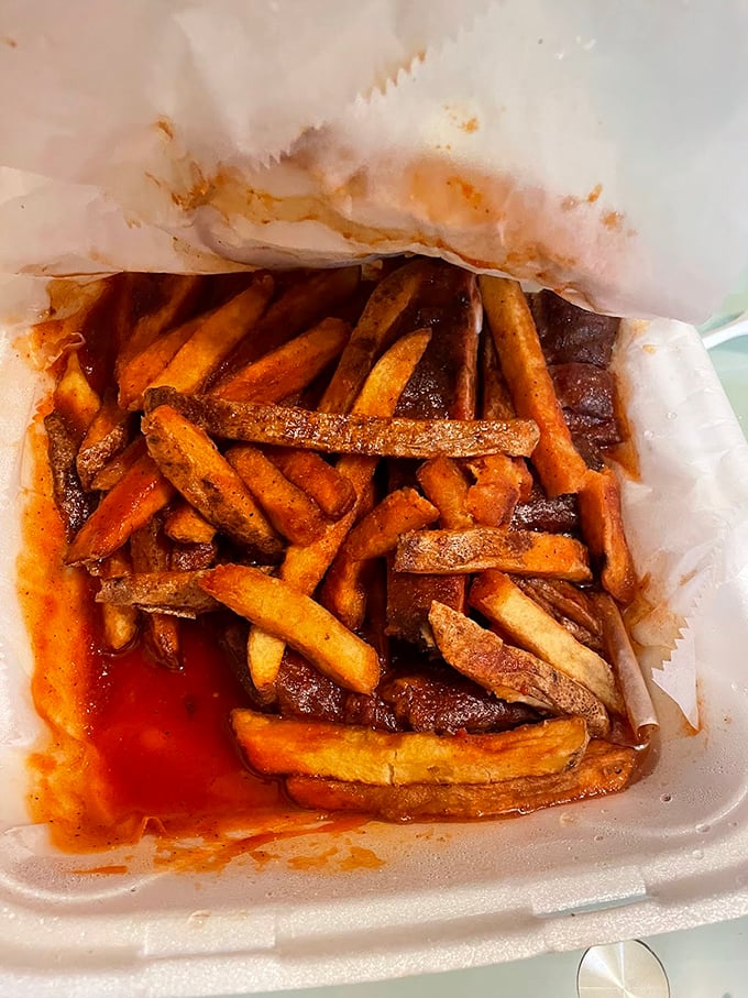 French fries bathed in that signature sauce—like little potato soldiers marching straight into flavor country. Resistance is futile, just grab a fork.