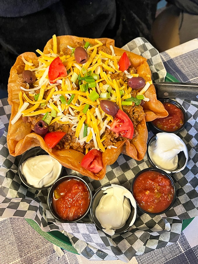 A taco salad big enough to require its own zip code, where lettuce actually plays a supporting role.