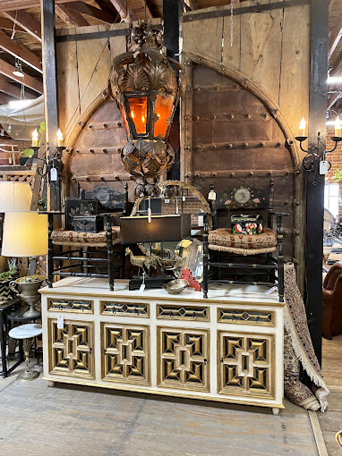 This paint-splattered workbench now displays treasures instead of tools—the ultimate example of vintage upcycling at its most authentic.