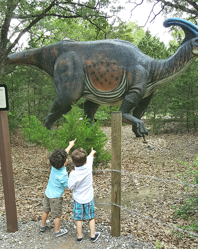 "And THIS is how tall it was!" Young visitors get a proper sense of scale when standing beneath these gentle giants.