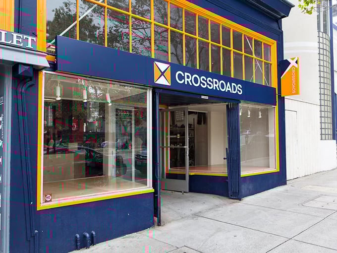 Crossroads Trading's bold blue and yellow color scheme pops against the urban backdrop. Fashion recycling never looked so inviting!