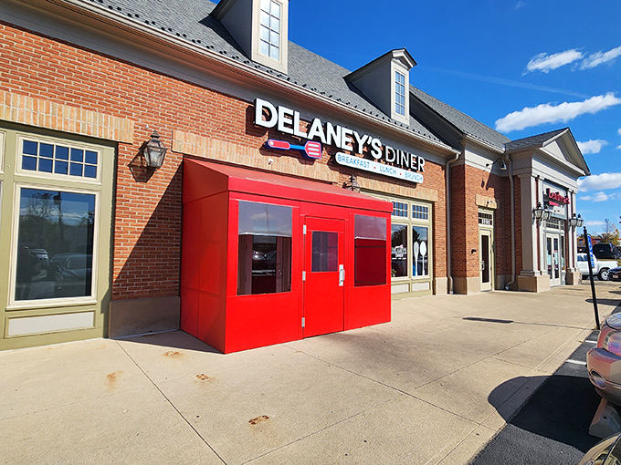 Delaney's Diner (Columbus): That bold red entrance pops against classic brick – a modern diner where farm-fresh eggs meet wallet-friendly prices.