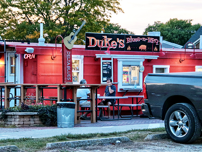 Duke's fiery red exterior and porch seating invite you to slow down, dig in, and maybe tap your foot to some blues.