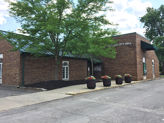Loveland's City Hall stands as a brick testament to small-town governance—where decisions are made by neighbors, not strangers.