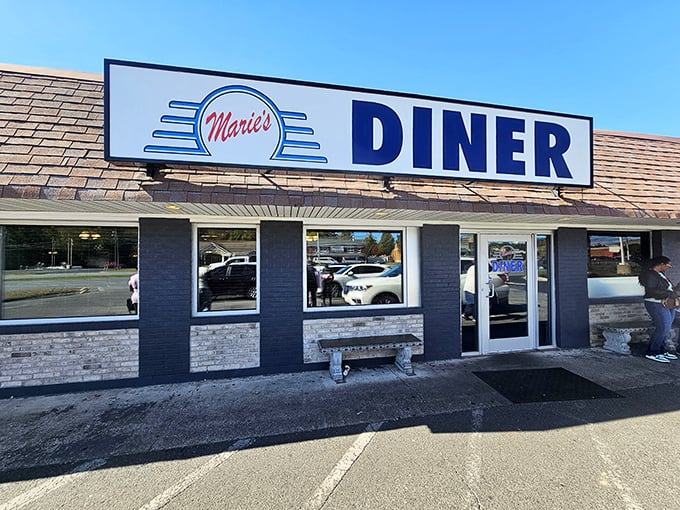 Marie's Diner (exterior sign): "Simple sign, extraordinary eggs. Marie's proves that sometimes the best things come in unassuming brick packages."