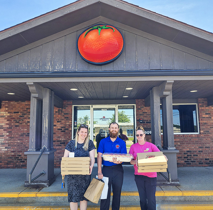 Nothing says "We take pizza seriously" like staff proudly displaying their boxed-up treasures outside the restaurant.