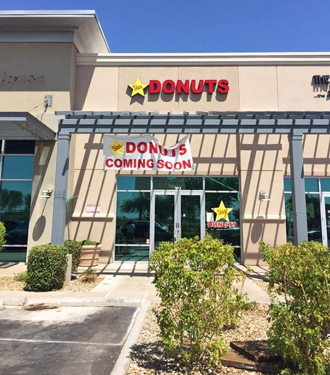 Star Donuts' cheerful yellow star logo brightens any morning. "Coming Soon" never looked so promising or made mouths water faster!