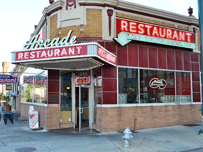 The Arcade's vintage neon glow beckons Memphis locals who know where authentic comfort food lives.