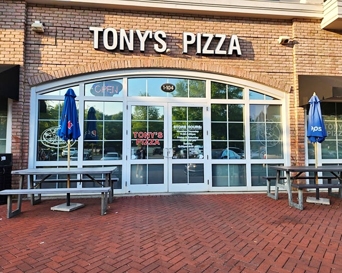Tony's Pizza brings a slice of New York to Charlotte with its classic brick storefront and inviting patio.