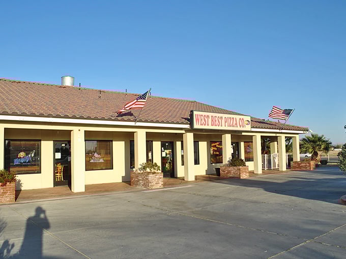 West Best Pizza's sun-washed storefront stands like a mirage in the high desert, promising cheesy salvation to California City locals.