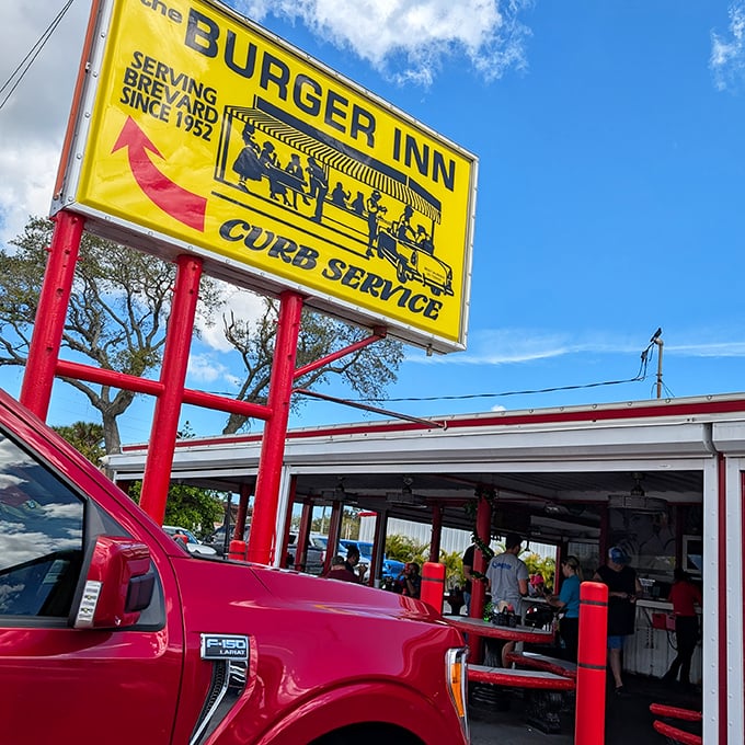 The vintage charm of Burger Inn's signage and red posts create a nostalgic burger experience. Some things never need changing.