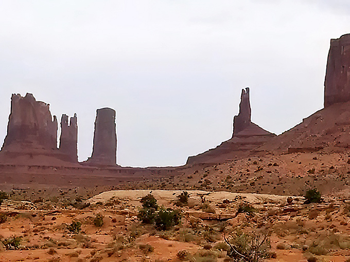 Monument Valley majesty! These towering rock formations stand like ancient skyscrapers built by nature's most ambitious architects.