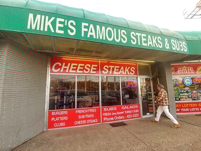 The green awning of Mike's Famous has sheltered generations of cheesesteak enthusiasts from both rain and hunger pangs.