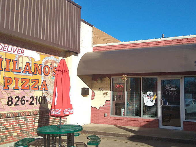 The Coca-Cola umbrella says it all – classic, refreshing, and universally loved. Milano's brings pizza perfection to the heart of small-town Texas.