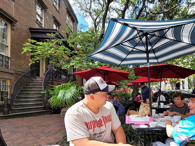 Striped umbrellas and brick courtyard – where strangers become friends over passed platters of fried chicken perfection.