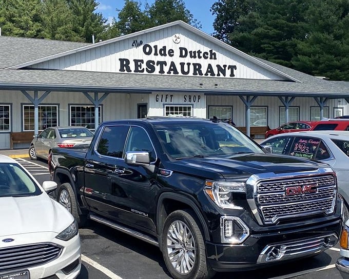 Olde Dutch's sign stands proud above a parking lot of hungry pilgrims. Those trucks aren't there by accident—they're driven by people who know good food.