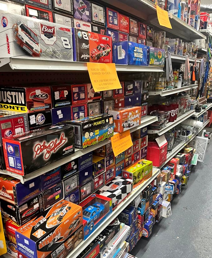 Racing memorabilia and nostalgic treasures line these packed shelves—each box a portal to someone's cherished memories.