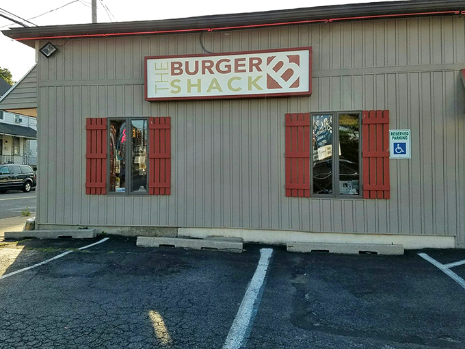 Simple gray siding and red accents – The Burger Shack knows flashy exteriors are unnecessary when your burgers speak volumes.