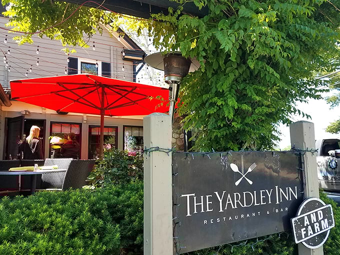 Those red umbrellas create the perfect spot for savoring fresh catches while pretending you're dining seaside, not riverside.