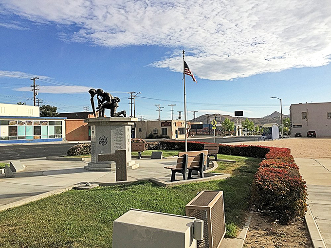 This veterans memorial creates a moment of reverence amid Victorville's desert landscape—where the flag stands especially bright against that impossibly blue sky.