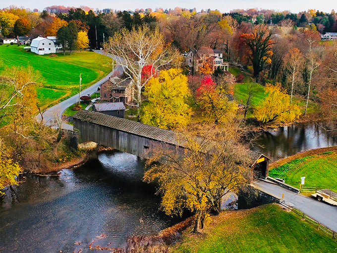 Autumn transforms the landscape into a painter's palette, with the bridge serving as the brushstroke that ties the composition together.