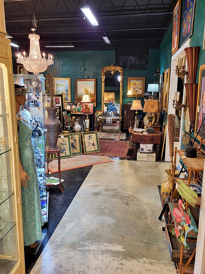 Teal walls and Persian rugs create the perfect backdrop for antique furniture and art, like walking into a more interesting version of history.
