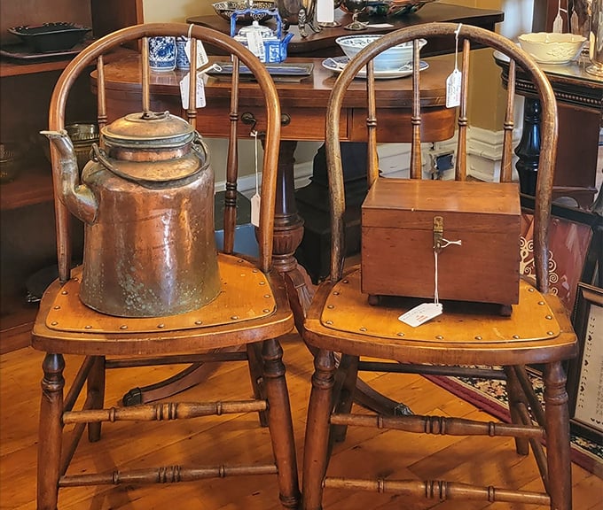 Colonial craftsmanship meets practical patina—that copper kettle has probably brewed tea for longer than most of us have been alive.