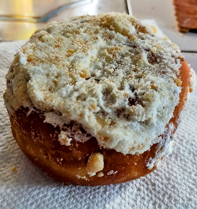 The apple crumb donut – where the crumbly topping creates a textural symphony that makes you wonder why anyone bothers with fancy desserts.