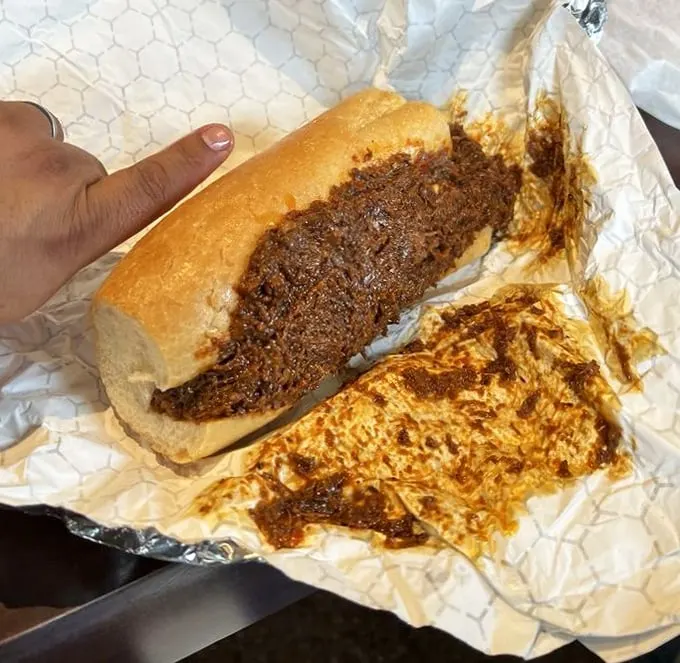 This isn't just a sandwich; it's a masterclass in beef preparation—tender, seasoned meat that's had a long, meaningful relationship with its gravy.