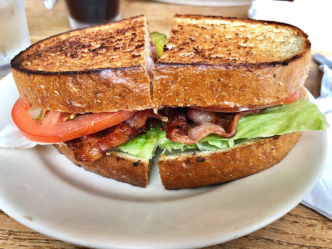 This BLT isn't playing games—thick-cut bacon, garden-fresh tomatoes, and crisp lettuce on perfectly toasted bread that shatters just right.