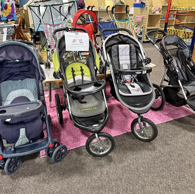 Stroller showroom or new parent survival center? These gently-used chariots cost less than the hospital parking fee when baby arrived.