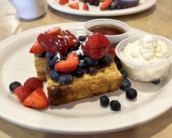 French toast that's dressed for success, topped with berries that didn't just fall on the plate – they made a grand entrance. 