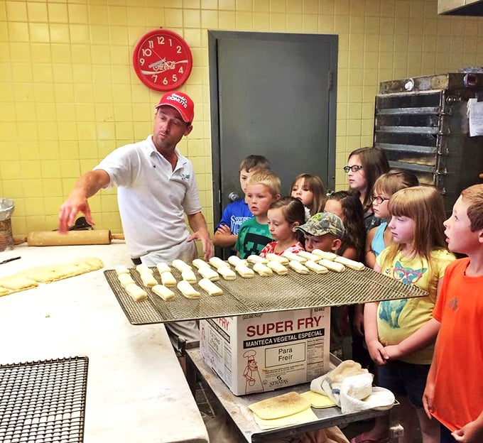 Passing down the sacred art of donut-making to the next generation. These wide-eyed kids are witnessing real magic – no wizarding school required, just flour, sugar, and tradition.