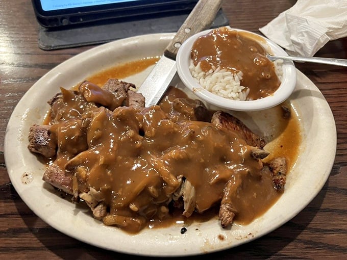 Beef tips swimming in gravy so good you'll be tempted to drink it with a straw. The rice isn't just a side—it's the perfect gravy delivery system.