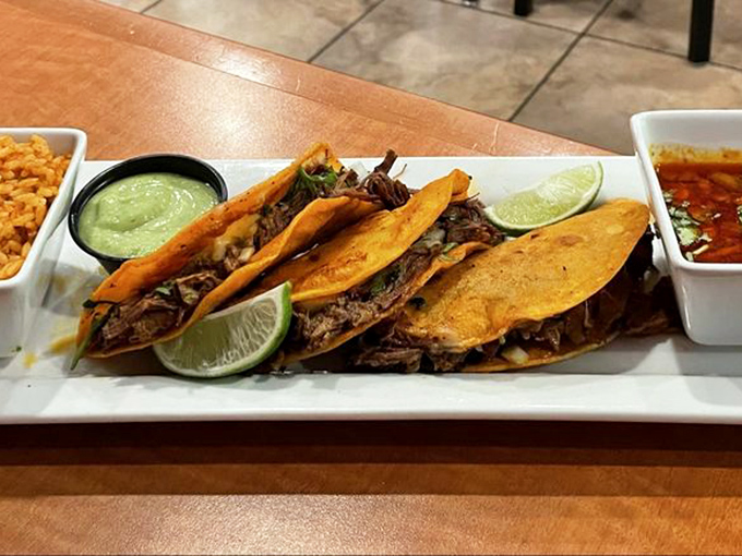 Birria tacos that bring Mexican street food flair to the Keystone State, with lime wedges standing by for that perfect citrus punch.