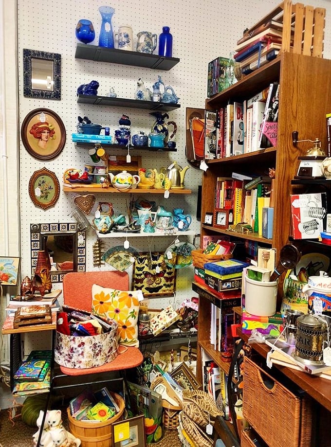 Organized chaos at its finest! This booth is what happens when your coolest aunt's collection of mid-century treasures explodes in technicolor glory.