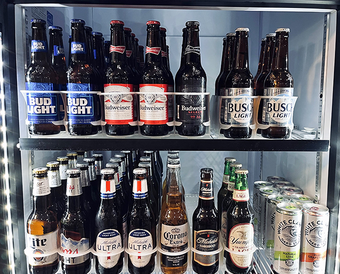 The beer fridge at Bandana's understands Missouri priorities – cold comfort for when the spicy sauce starts doing its dance.