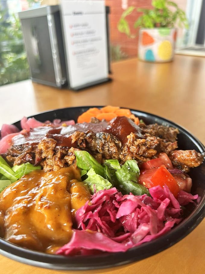 A barbecue bowl that eats like a color wheel of flavors—smoky meat, bright vegetables, and that pink cabbage adding tangy crunch to every bite.