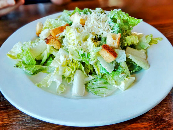 Even the Caesar salad gets the coastal treatment – crisp, bright, and ready to cleanse your palate between seafood adventures.