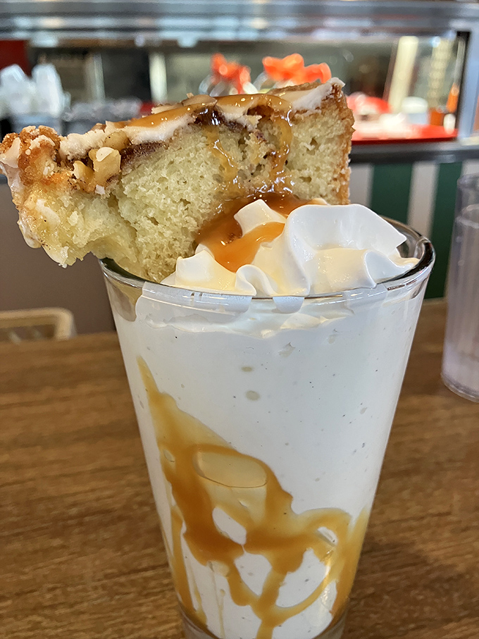 Part milkshake, part dessert, part architectural marvel—this cake-topped creation makes adult responsibilities seem temporarily optional.
